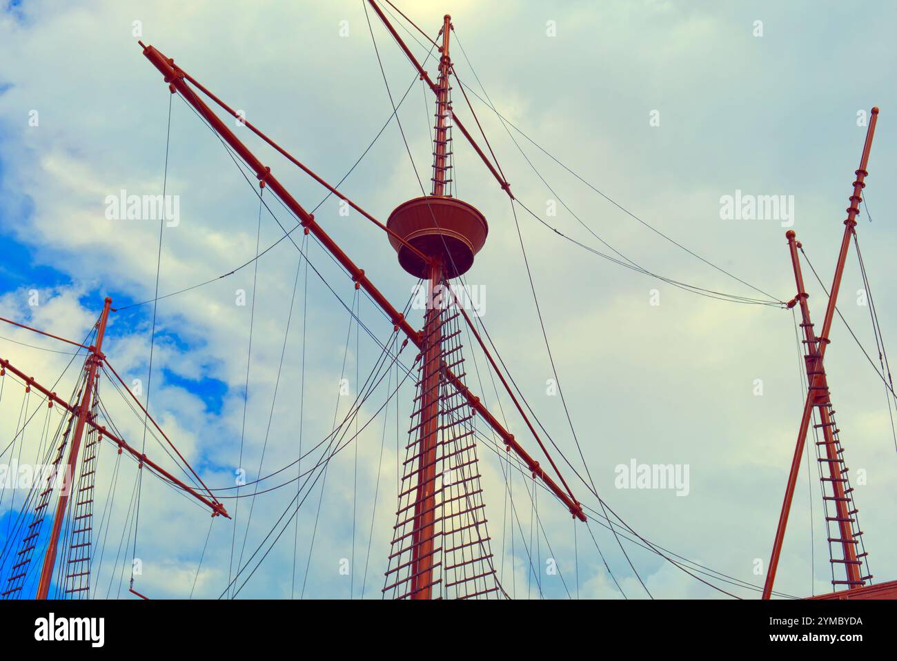 Clear blue sky, double mast sail boat, sails down, slight breeze Stock ...