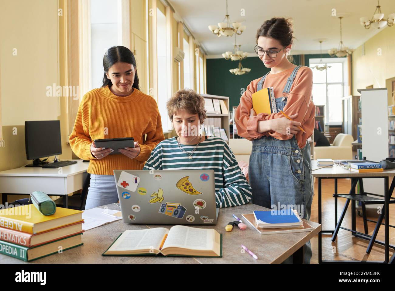 Collaborating in Study Room with Electronic Devices Stock Photo - Alamy
