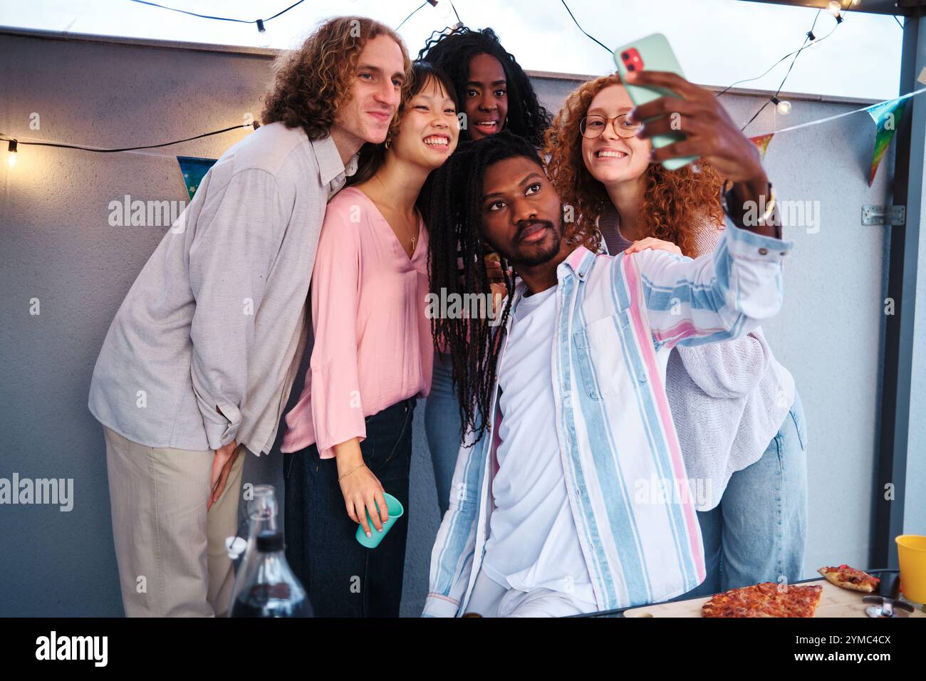 Multiethnic group gathering rooftop party hi-res stock photography and ...