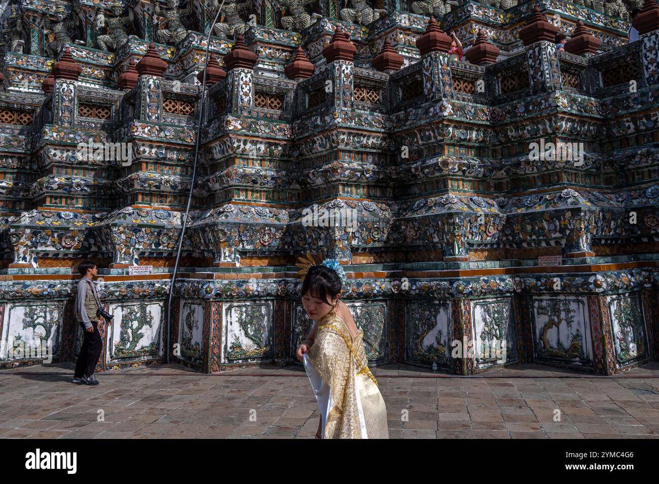 Bangkok, Thailand. 21st Nov, 2024. A tourist dressed in traditional Thai clothing seen poses for ...