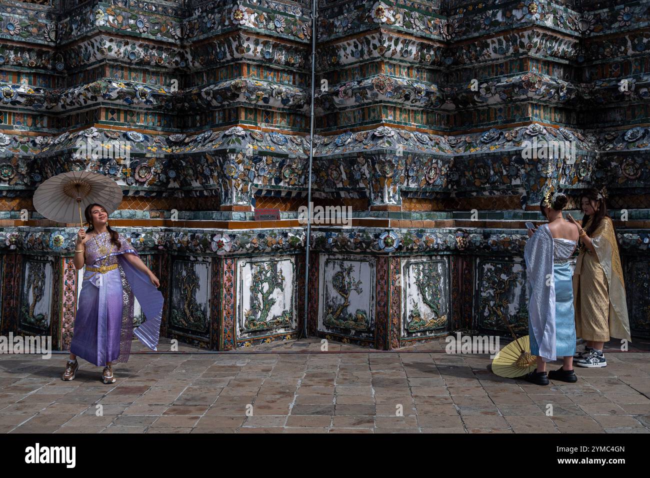 Bangkok, Thailand. 21st Nov, 2024. Tourists dressed in traditional Thai clothing seen pose for a ...