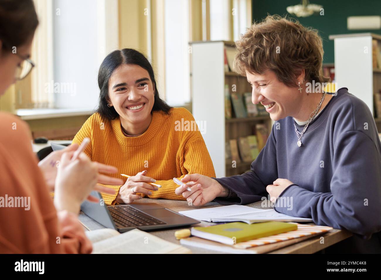 Smiling students studying on hi-res stock photography and images - Alamy
