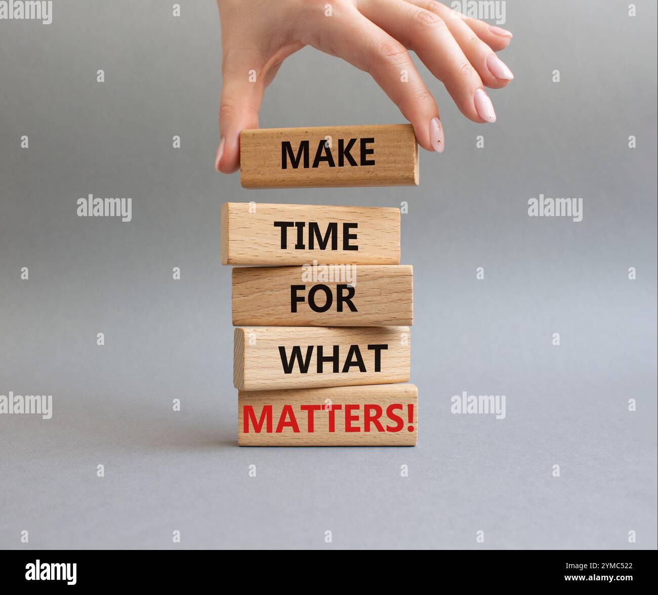 Important thing symbol. Wooden blocks with words Make time for what matters. Businessman hand ...