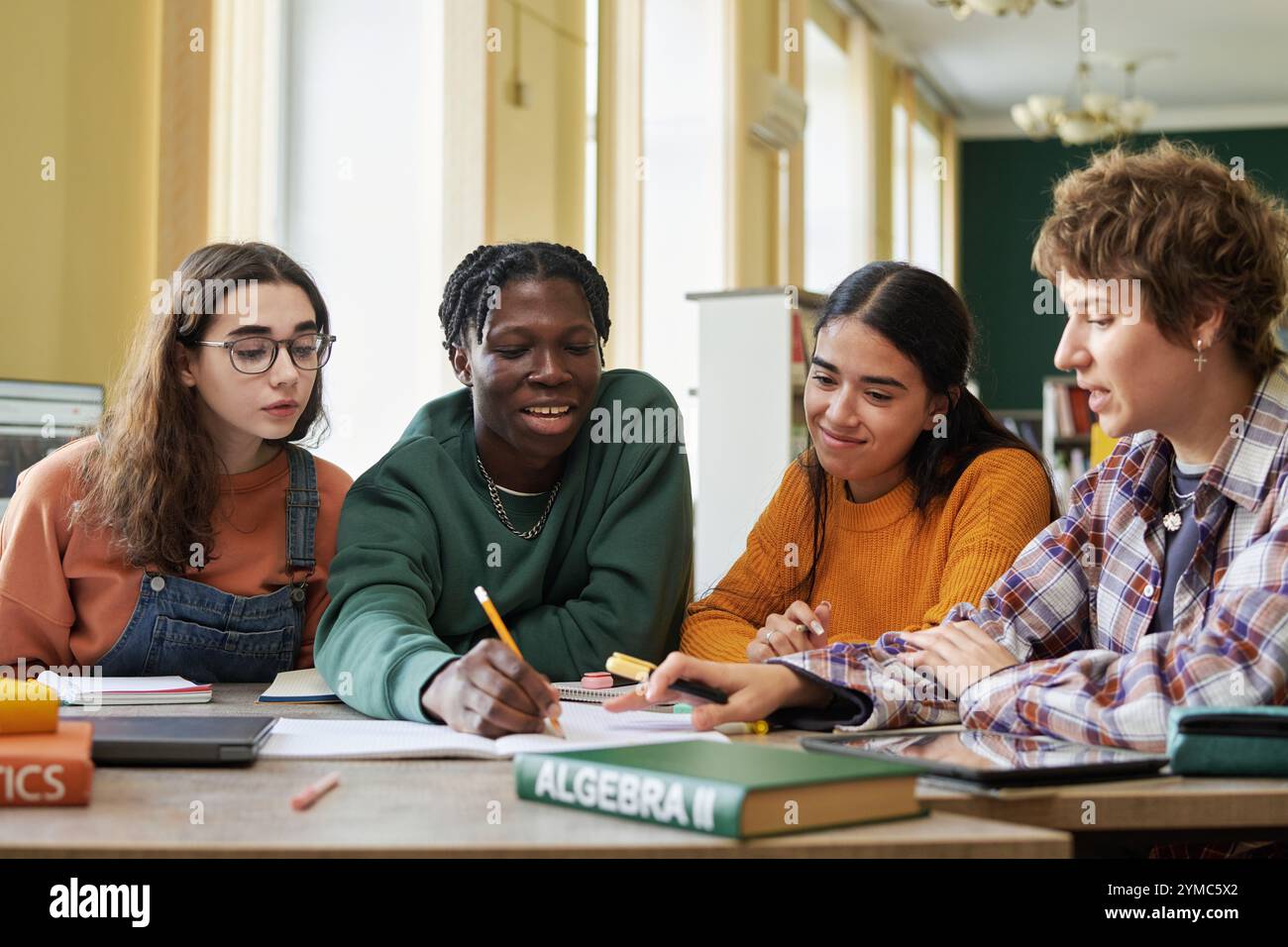 Collaborating Students Working on Algebra Project Together Stock Photo - Alamy