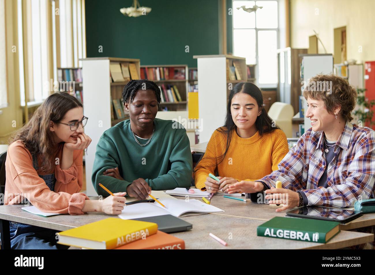 Diverse Group Studying Together in Library Setting Stock Photo - Alamy
