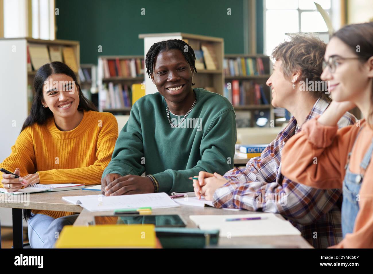 Diverse Group of Students Studying Together in Library Stock Photo - Alamy