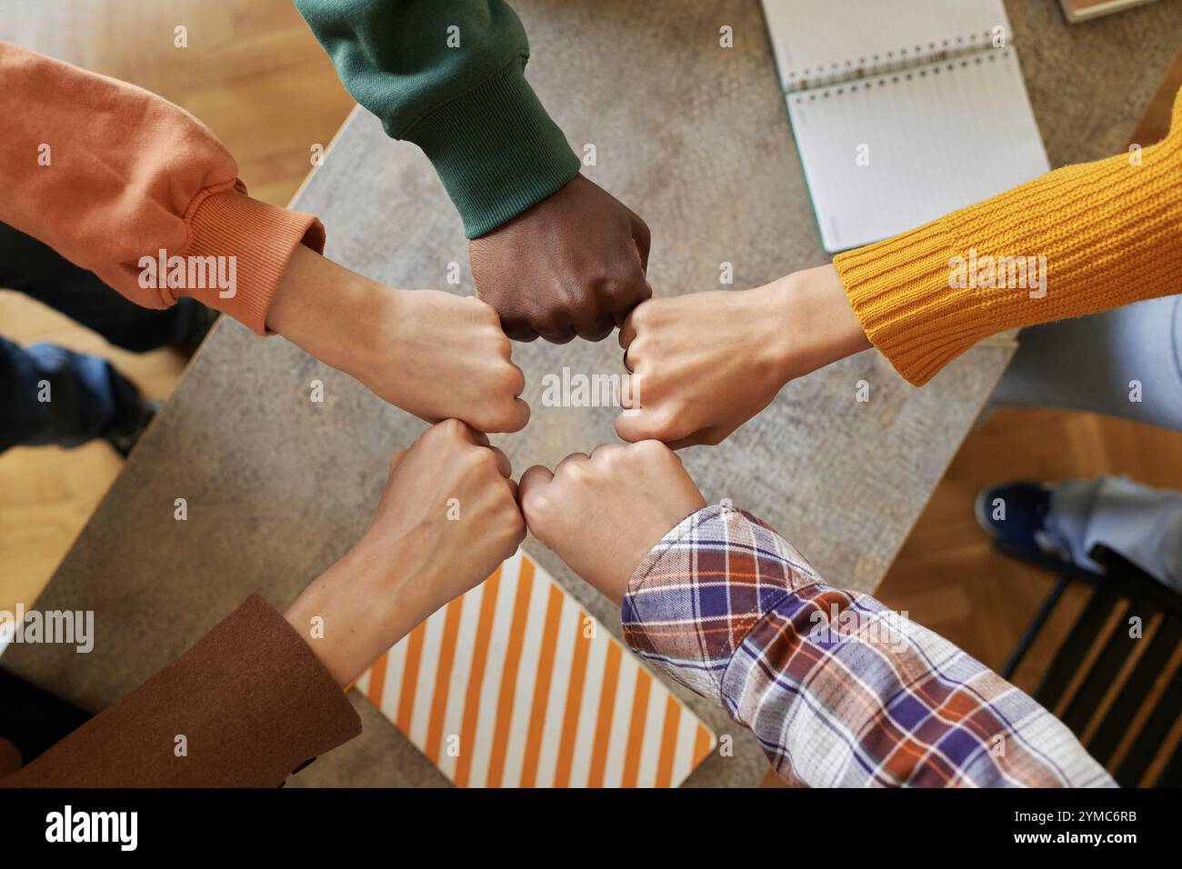 Joining Hands in Group Teamwork Gesture of Unity Stock Photo - Alamy