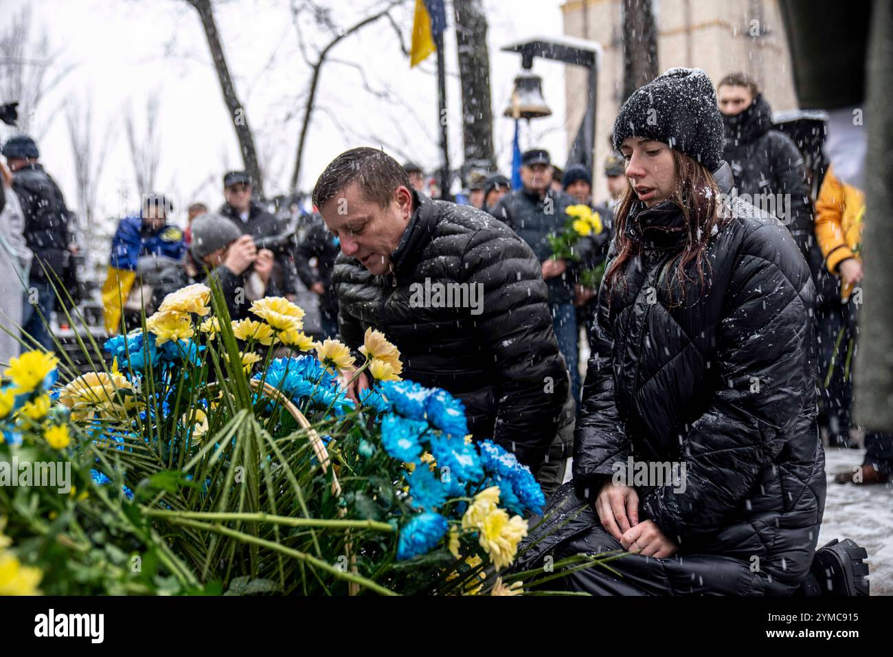 Ukrainians laying flowers, honoring fallen fighters at commemoration of ...