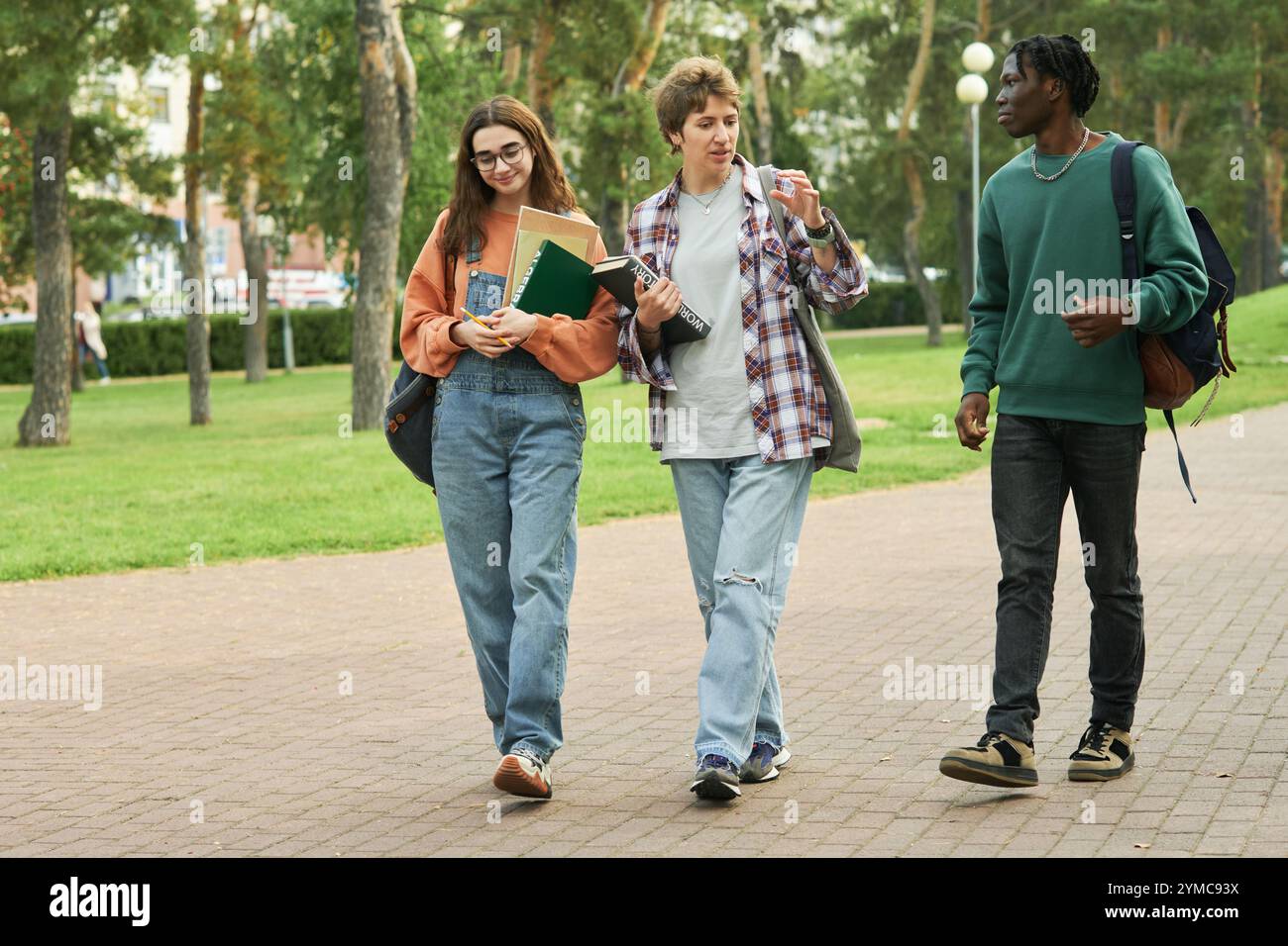 Engaging in Conversation While Walking Through Campus Stock Photo - Alamy