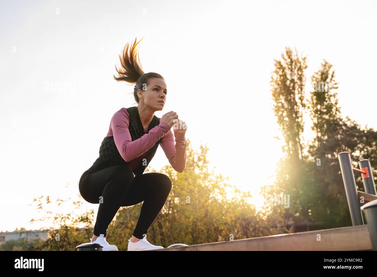Woman performing jumping exercise on hi-res stock photography and ...