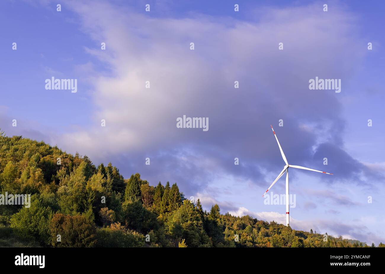 Wind turbine produce electricity and sunlight during sunset ...