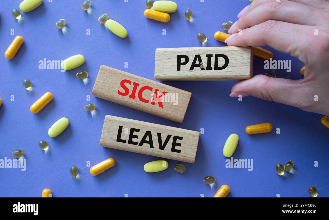 Paid Sick Leave symbol. Concept words Paid Sick Leave on wooden blocks ...