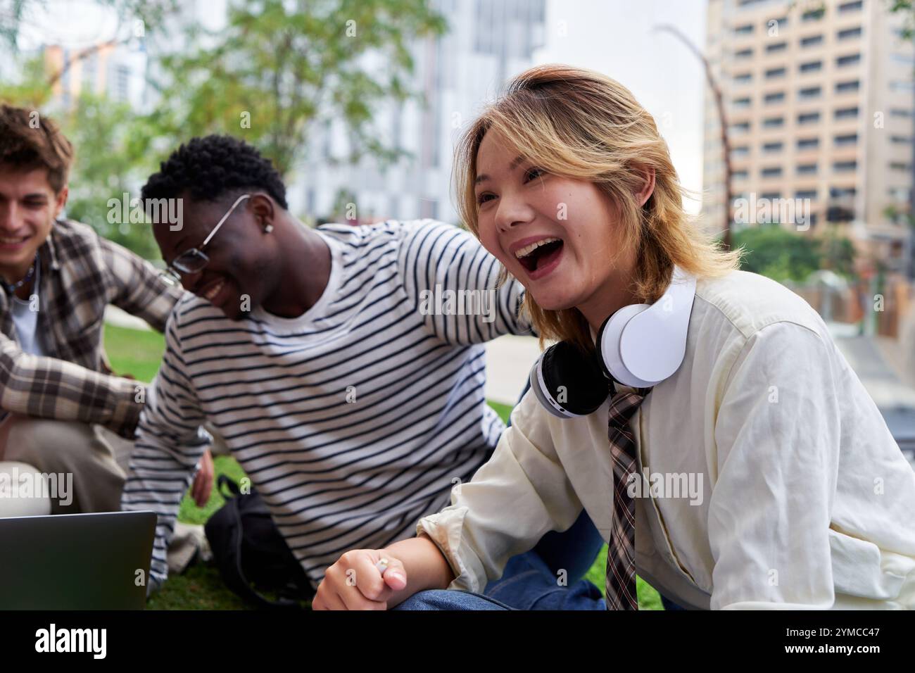 Chinese female student gathering with friends after class, laughing ...
