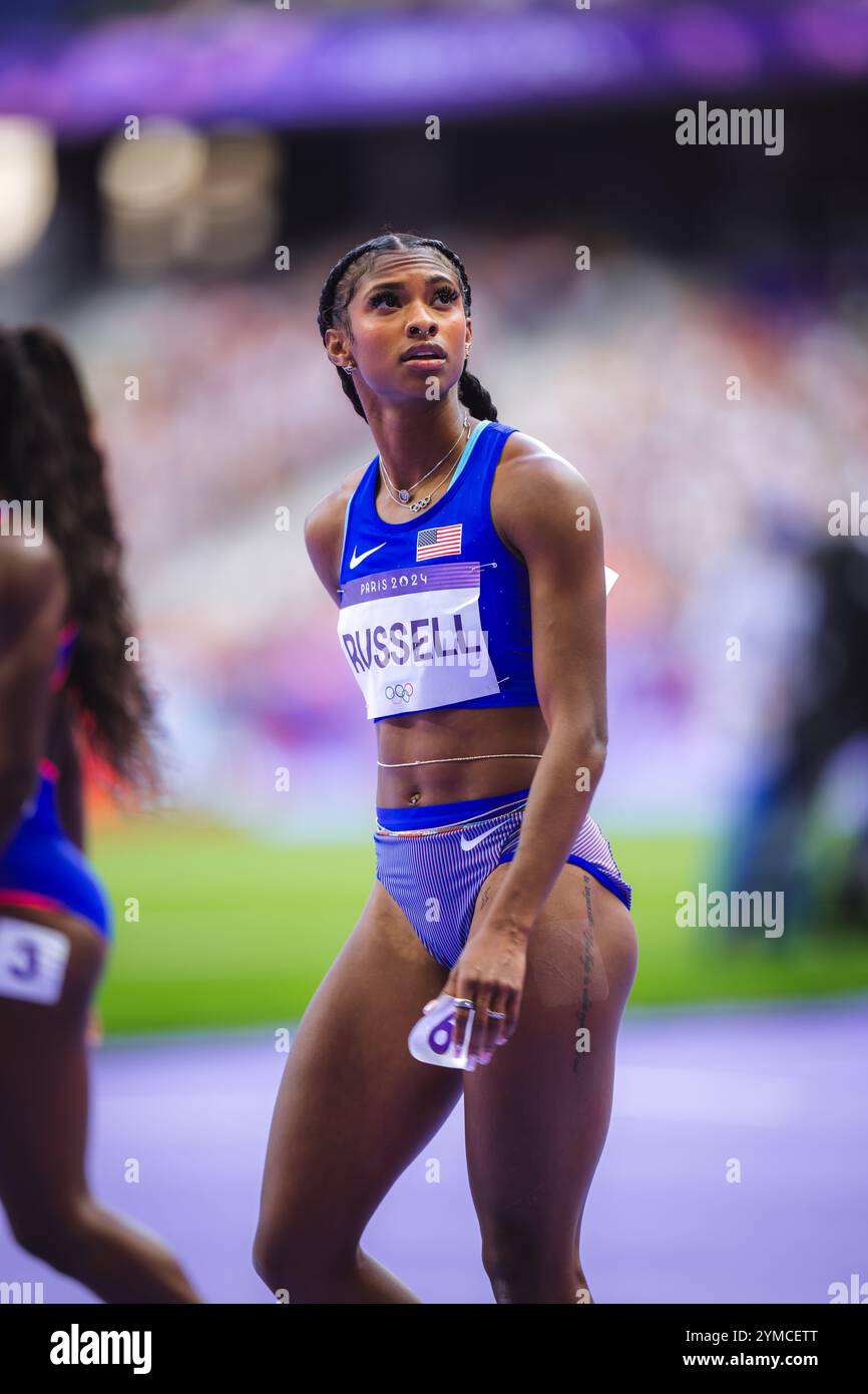 Masai Russell participating in the 100 meters hurdles at the Paris 2024 ...