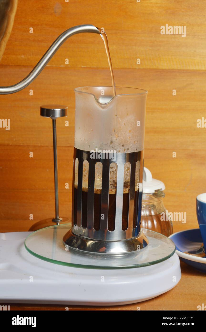 Coffee dripping in french press method Stock Photo - Alamy