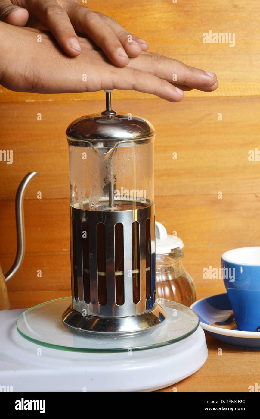 Coffee dripping in french press method Stock Photo - Alamy