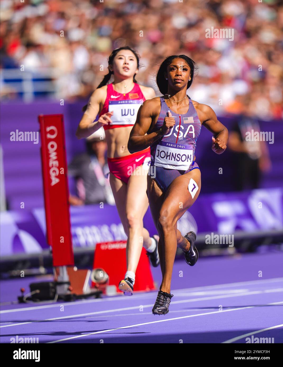 Alaysha Johnson participating in the 100 meters hurdles at the Paris ...