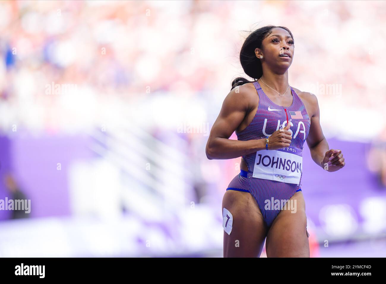 Alaysha Johnson participating in the 100 meters hurdles at the Paris ...