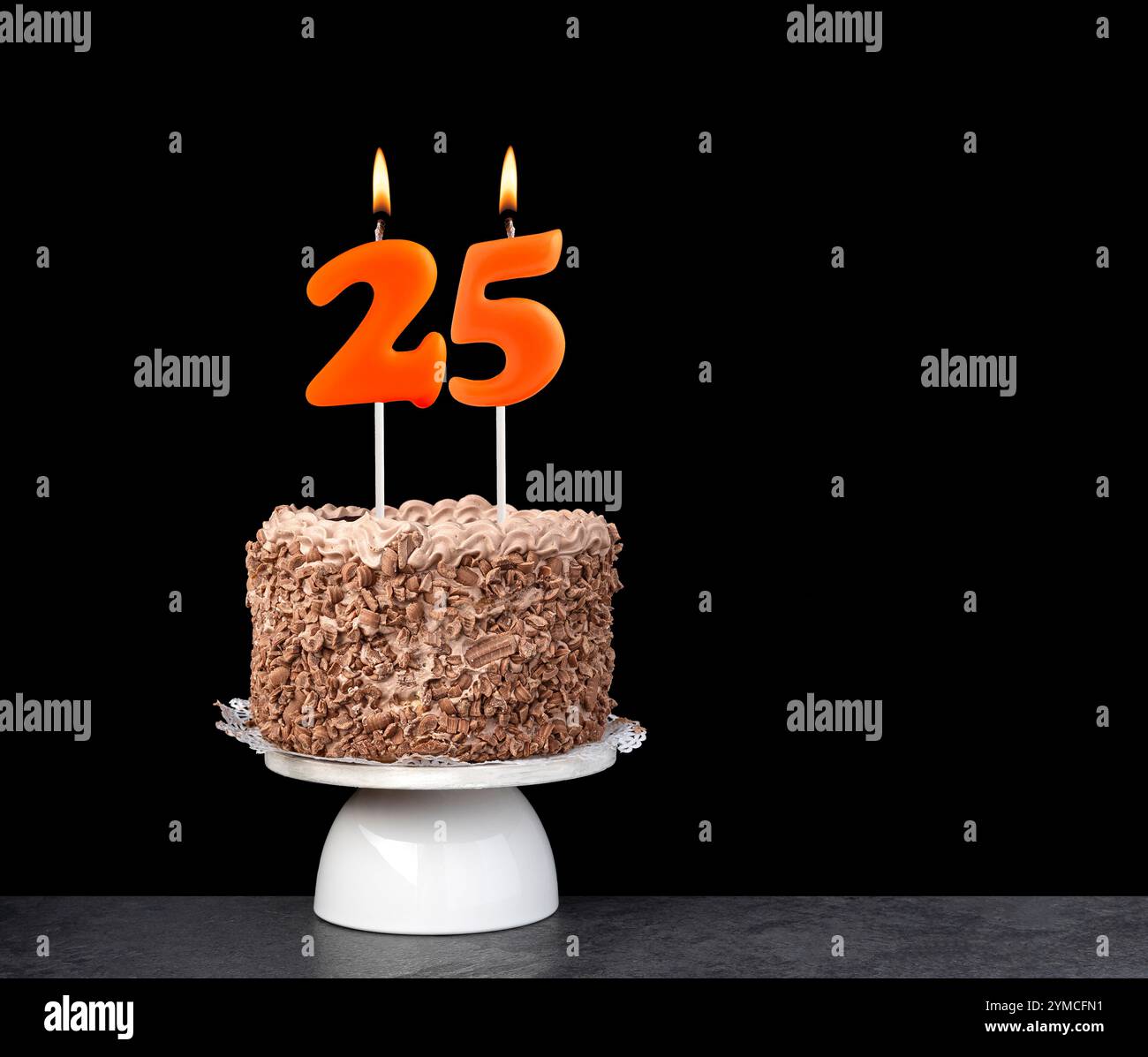 Birthday cake with number 25 candle - Anniversary card on a black ...