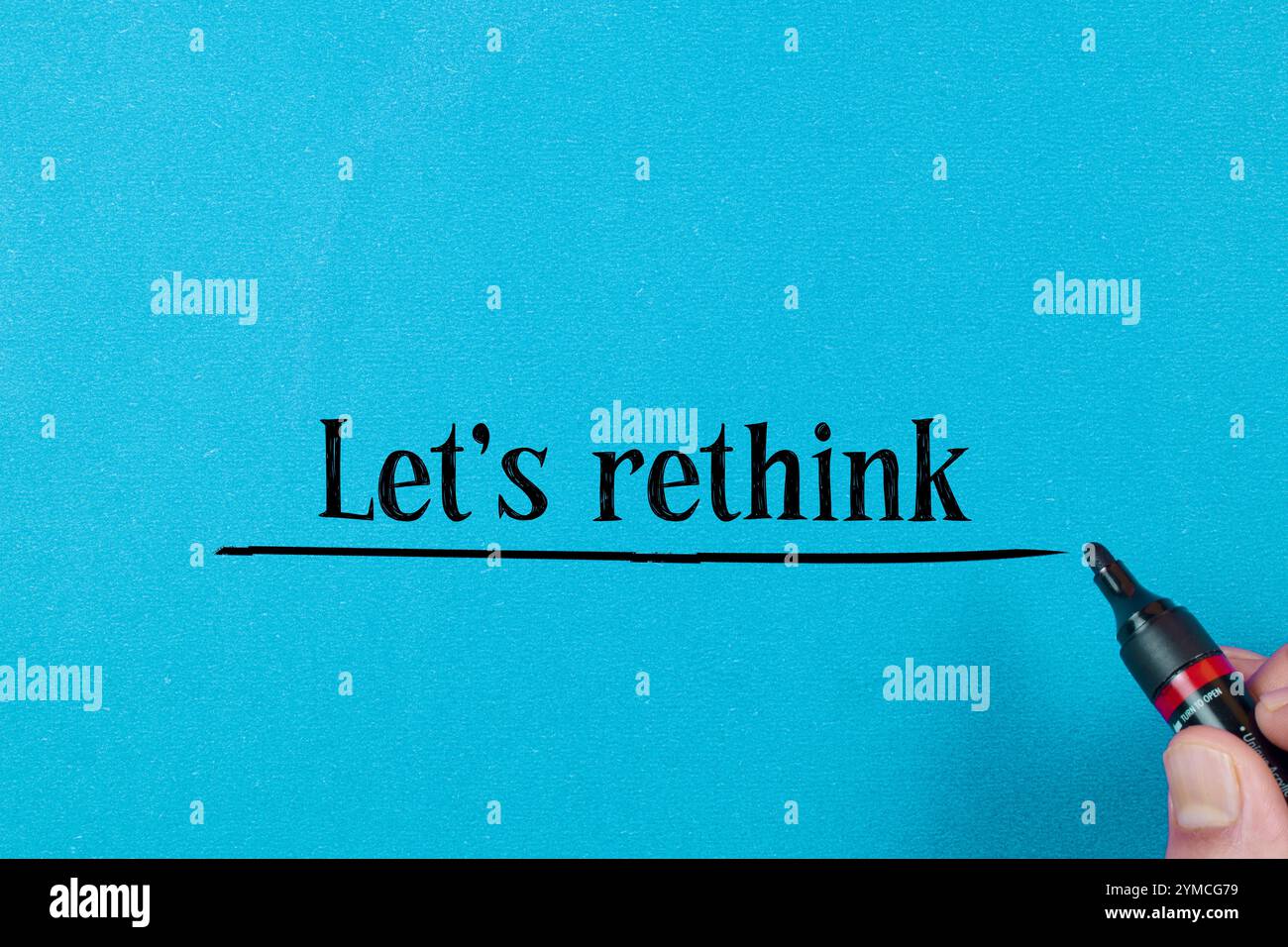 Concept words LET'S RETHINK written on blue background. Beautiful red ...