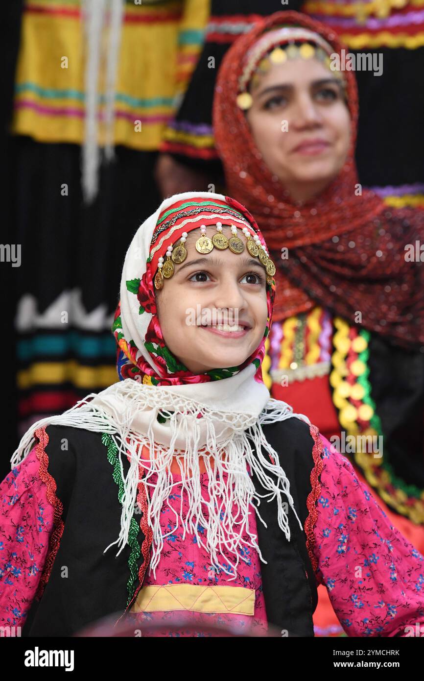 Rasht, Iran. 19th Nov, 2024. A girl dressed in traditional clothes is ...