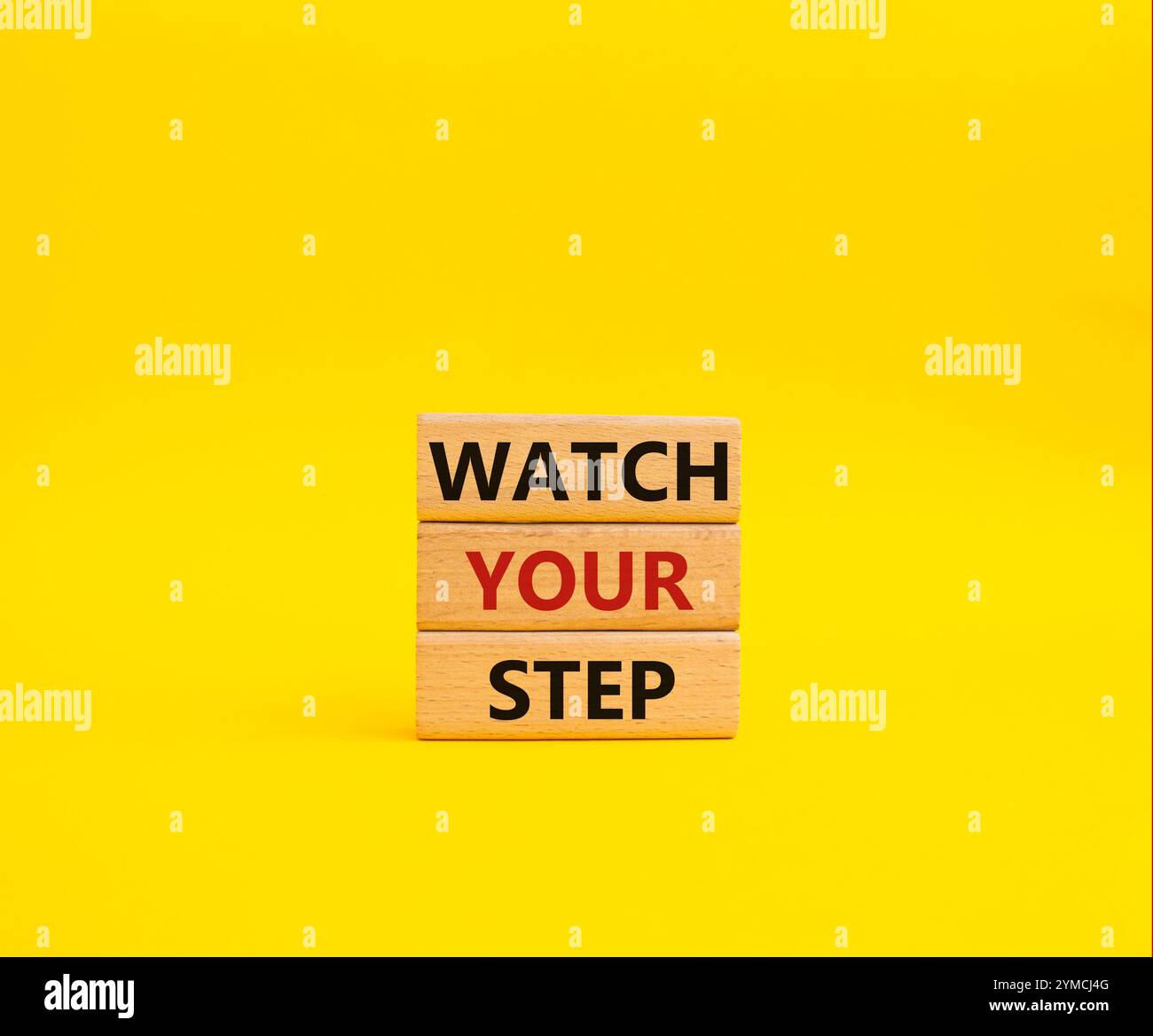 Watch your Step symbol. Concept words Watch your Step on wooden blocks ...