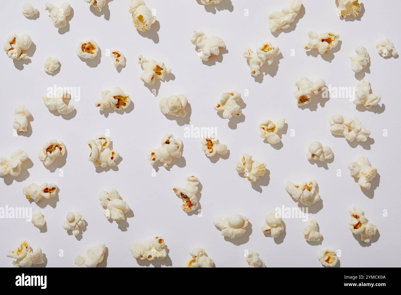 Overhead view of popcorn on white background Stock Photo - Alamy