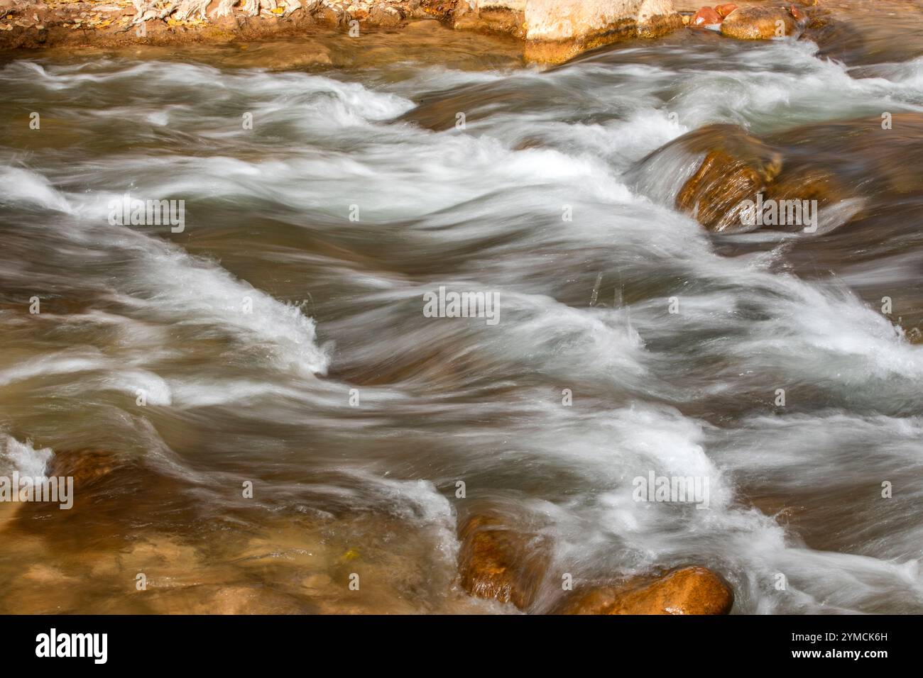 Close-up of water flowing on rocks, long exposure Stock Photo - Alamy