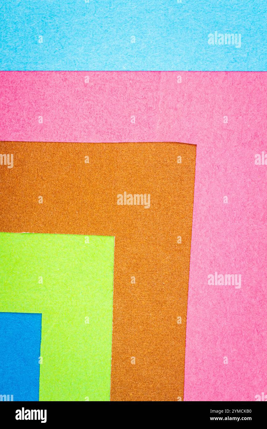 Multi color background from a paper of different colors. Abstract ...