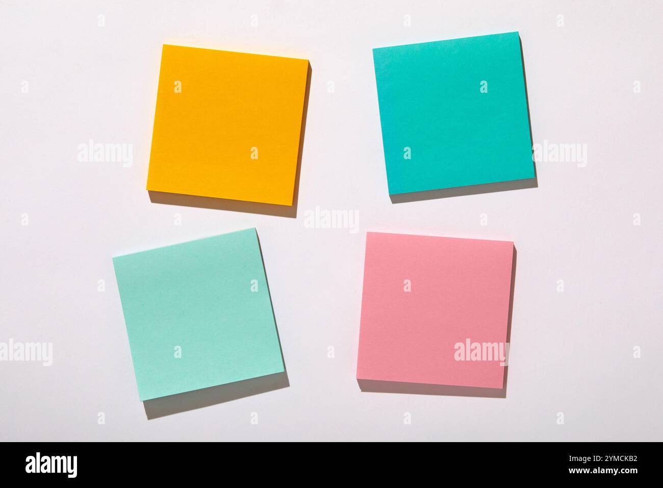 Colorful blank adhesive notes on white background Stock Photo - Alamy