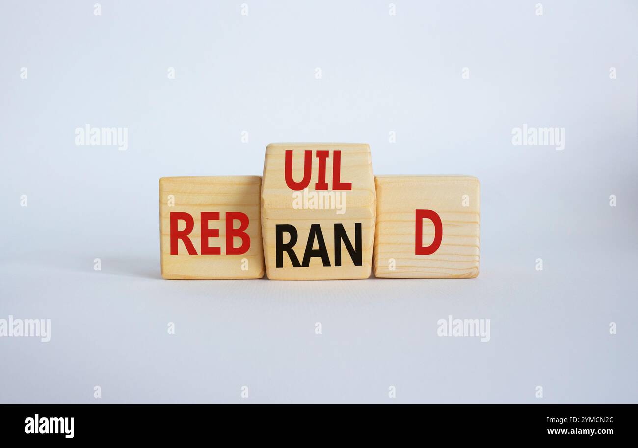 Rebuild and Rebrand symbol. Wooden cubes with words Rebrand and Rebuild ...