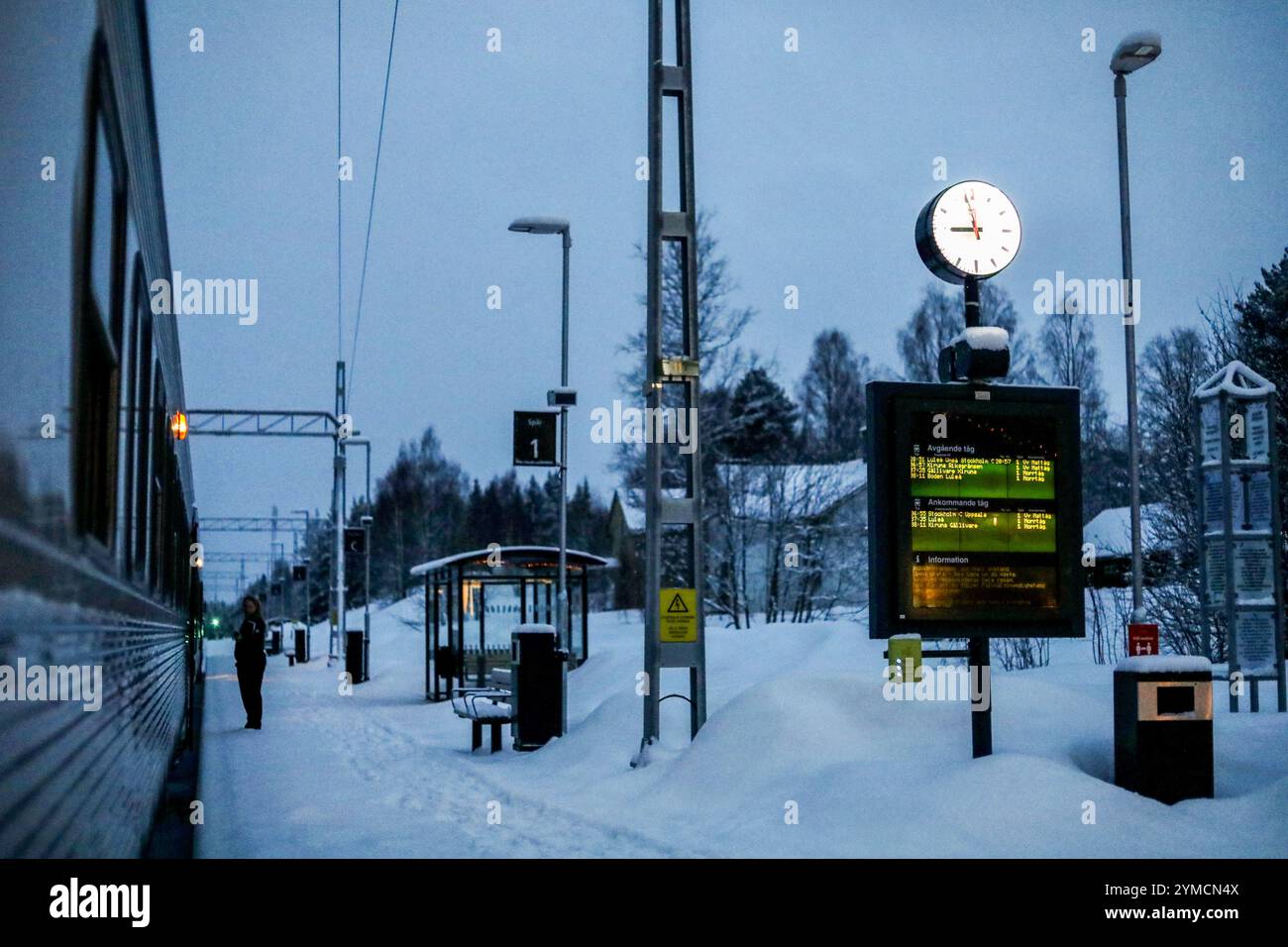 The night train between Kiruna and Stockholm stops at a station in ...