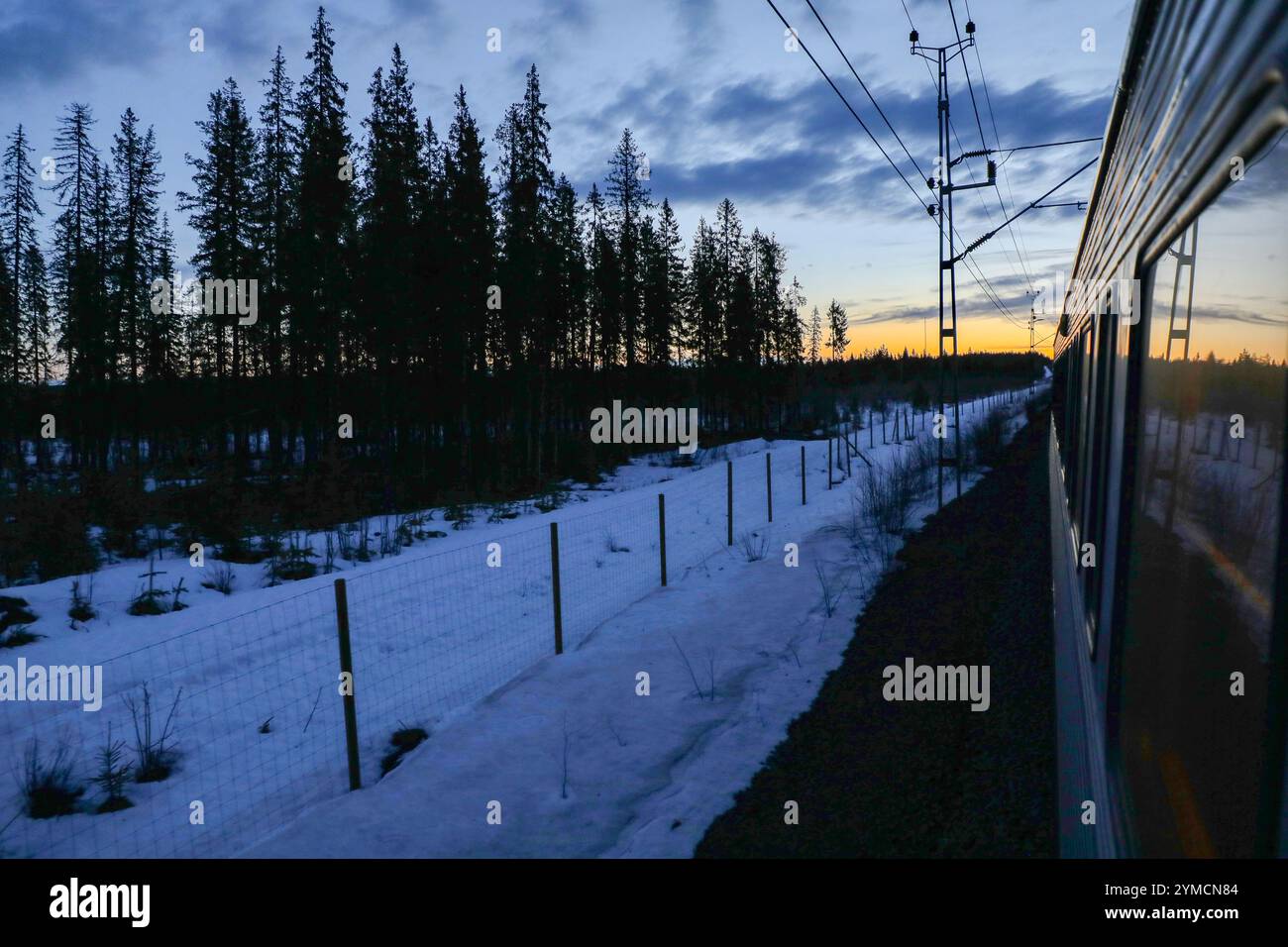 Sunrise over Swedish Lapland is seen from the night train from ...