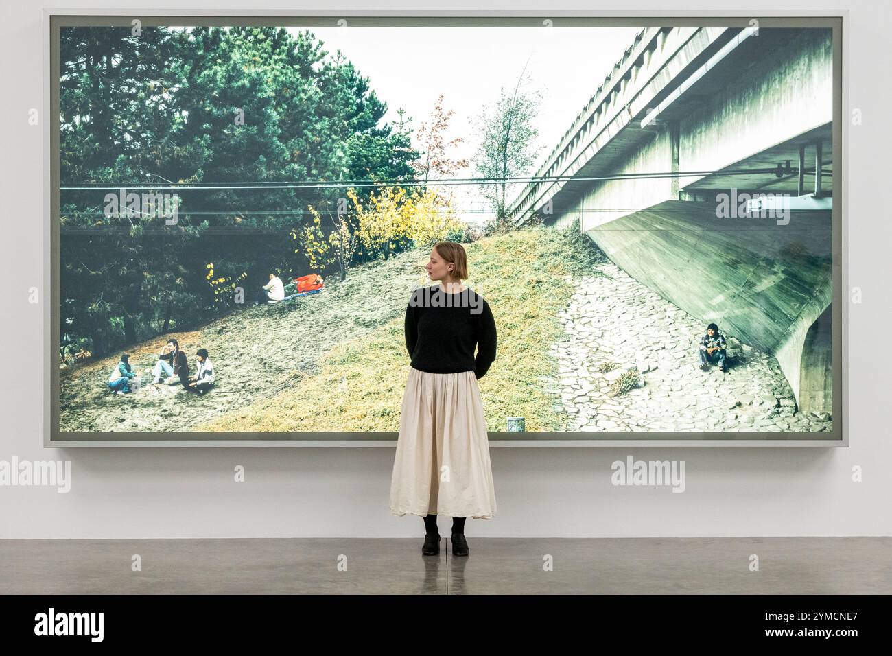 London, UK. 21 November 2024. A staff member with ‘The Storyteller ...