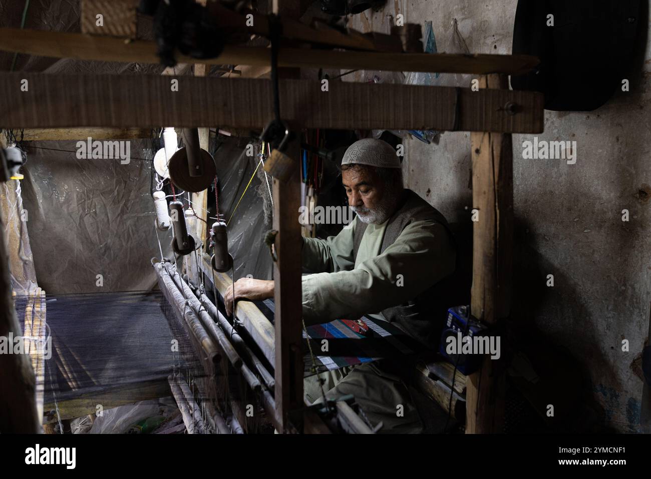 "Silk warp weaving using the oldest method in Herat province ...