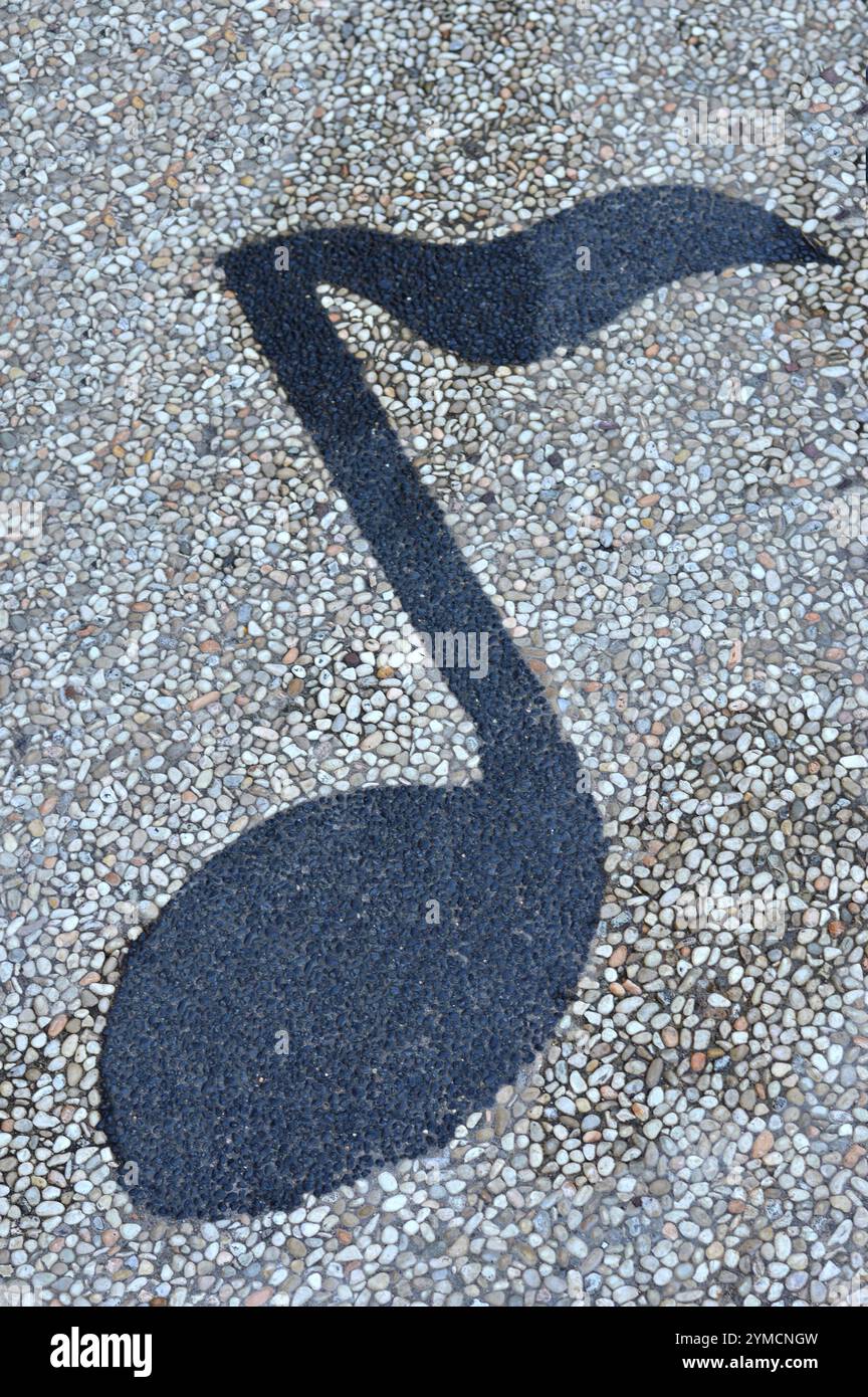 symbol of musical notes on the rock floor Stock Photo - Alamy
