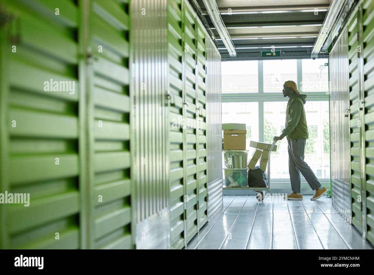 Man pushing cart loaded items hi-res stock photography and images - Alamy