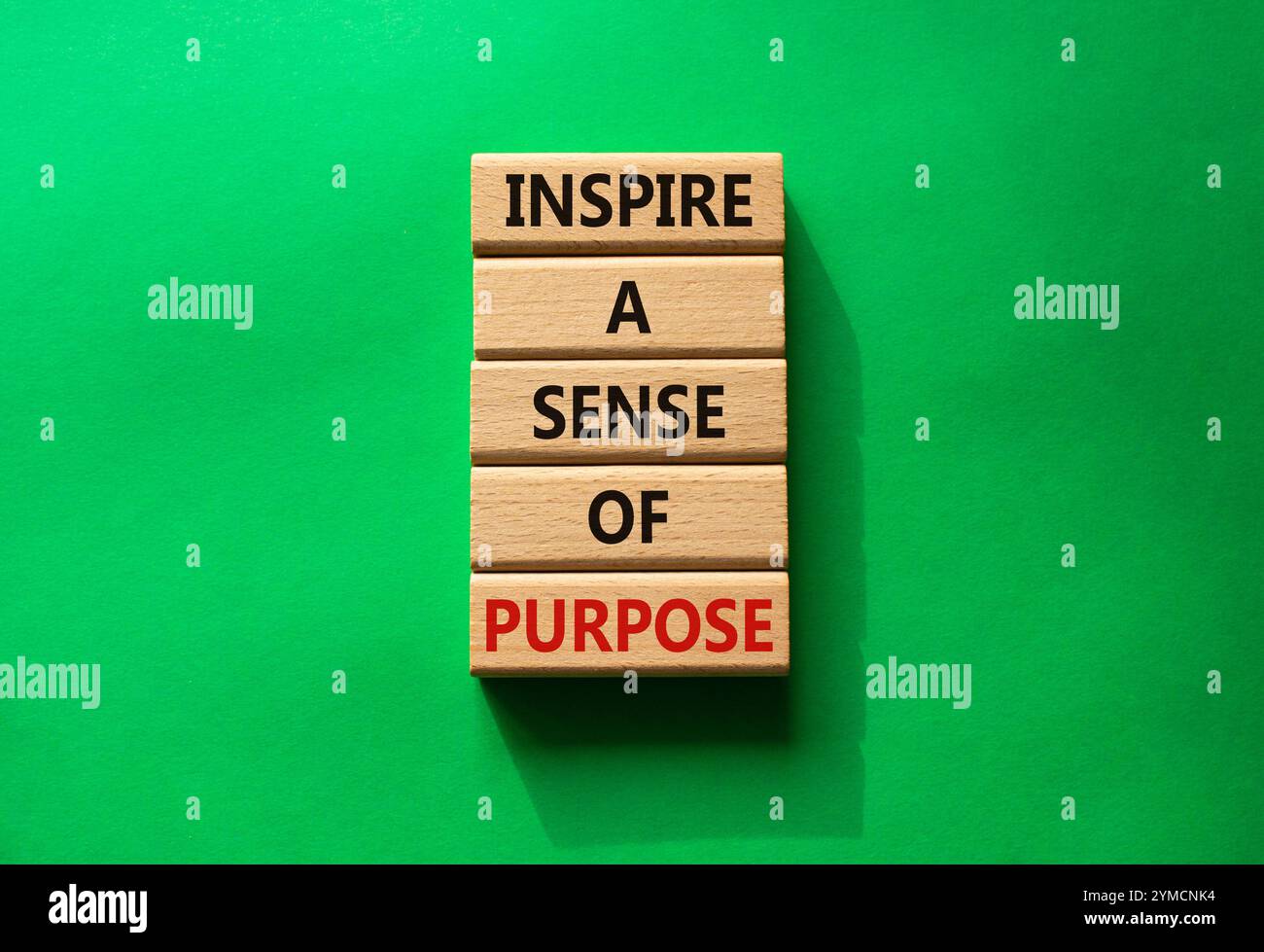 Purpose symbol. Wooden blocks with words Inspire a sense of Purpose ...