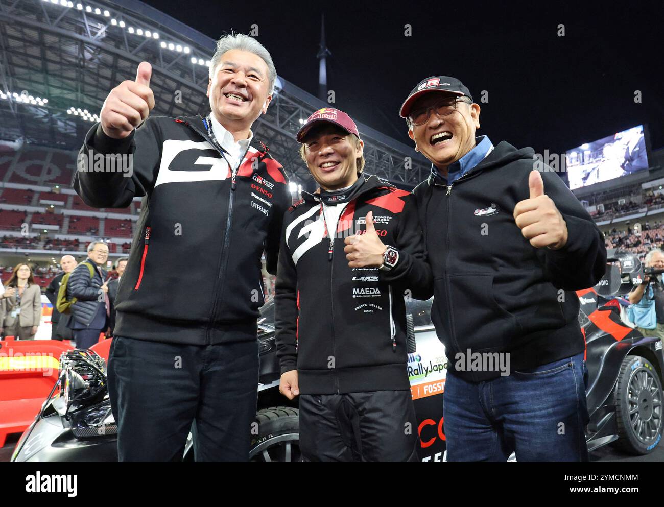 Japan's Takamoto KATSUTA of TOYOTA GAZOO Racing (C) and Akio TOYODA ...