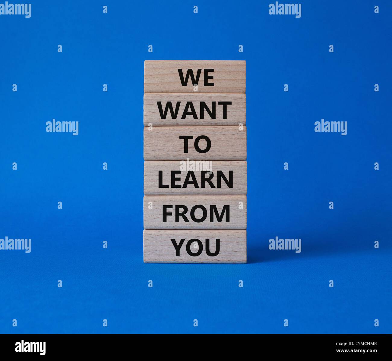 We want to learn from you symbol. Wooden blocks with words We want to ...