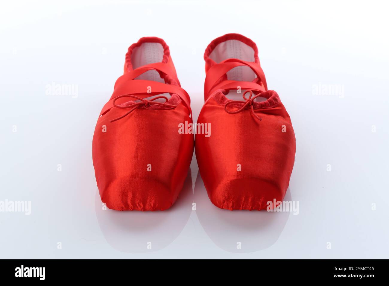 Pair of beautiful red pointe shoes isolated on white Stock Photo - Alamy