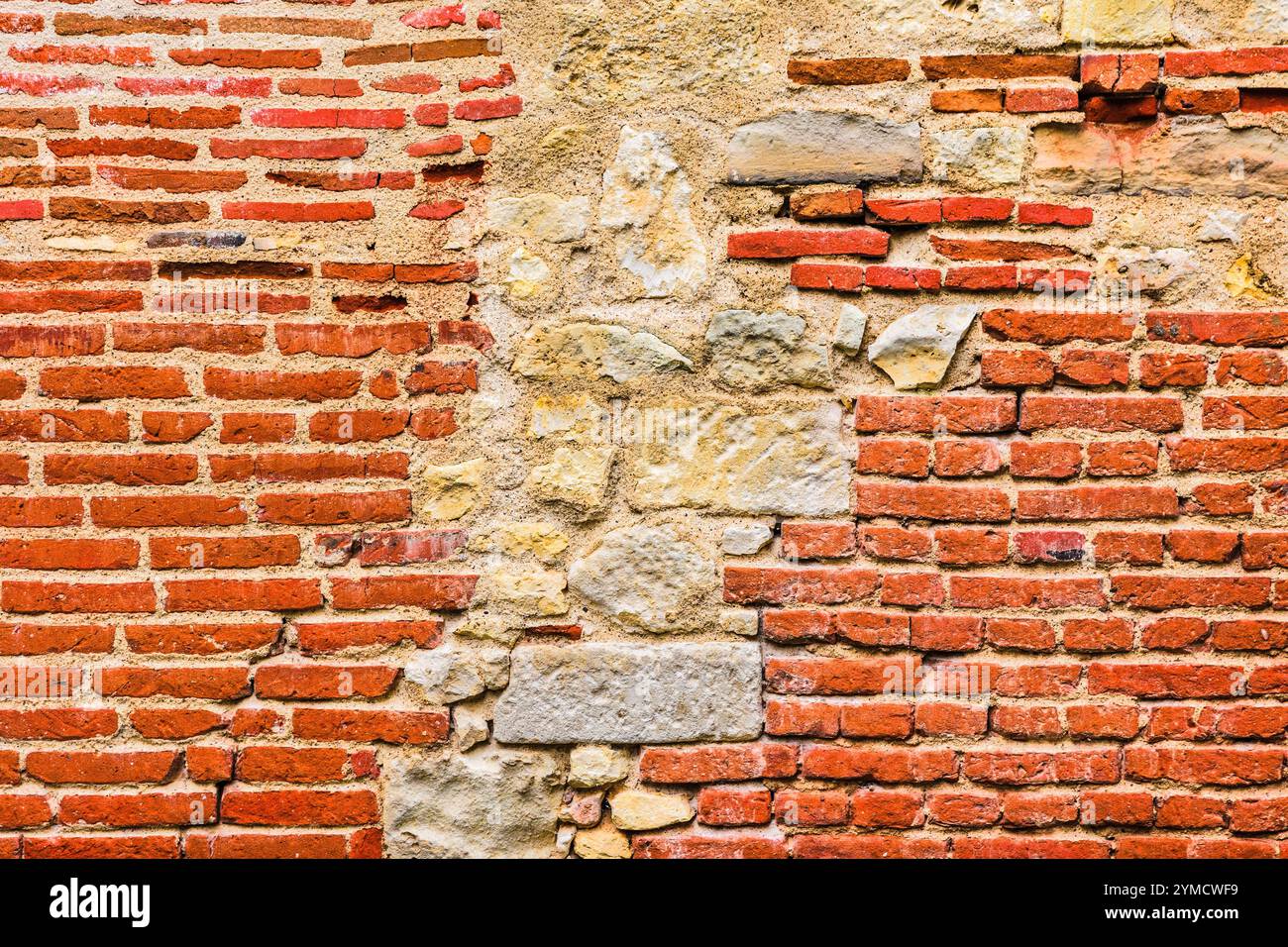 An old repair or rebuilding of a stone wall with red bricks - Angles ...