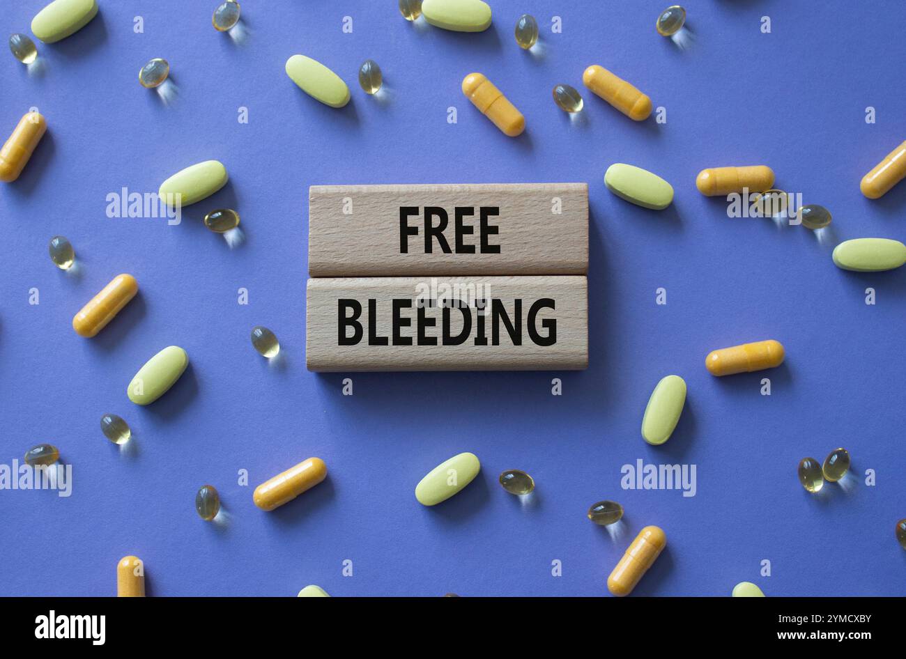 Free bleeding symbol. Concept words Free bleeding on wooden blocks ...