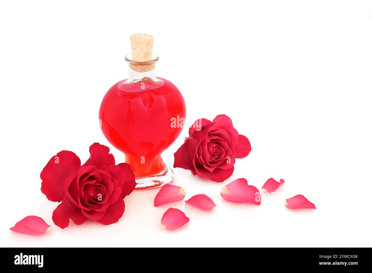 Valentine red rose flowers and heart shape perfume bottle on white ...