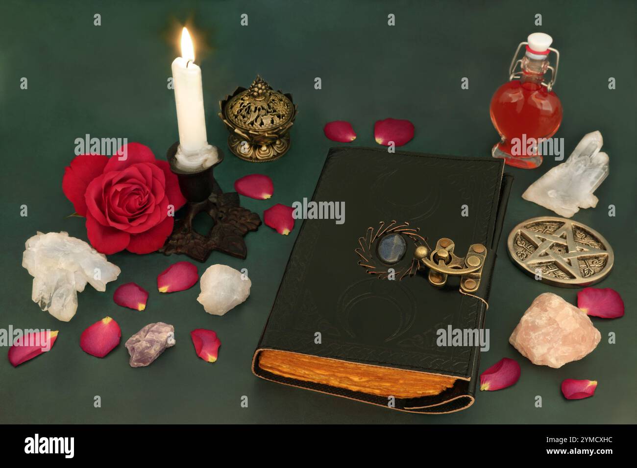 Witchcraft love potion concept with rose flower, petals, magical ...