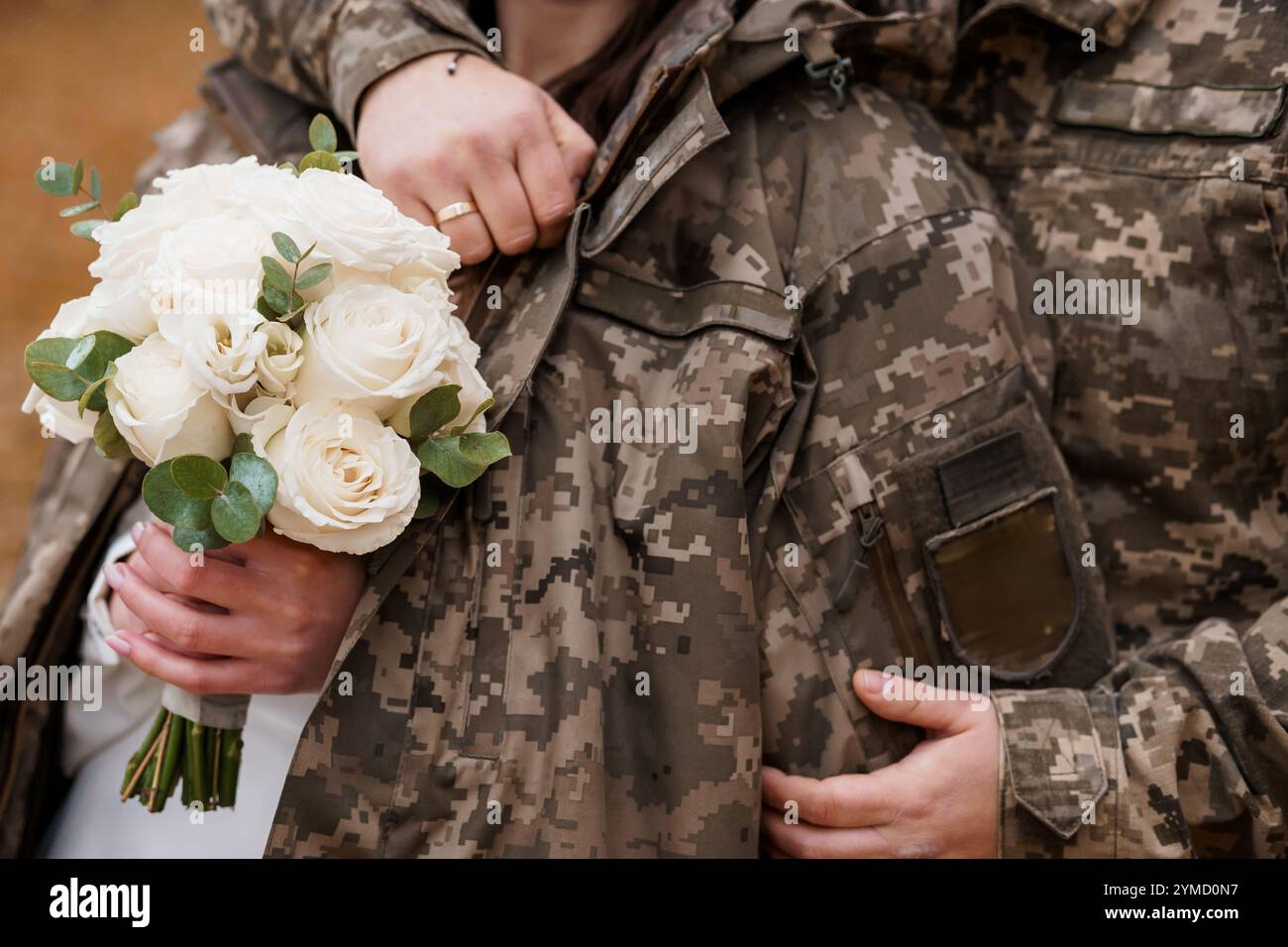 Romantic Military Wedding Embrace with Bouquet of White Roses Stock ...