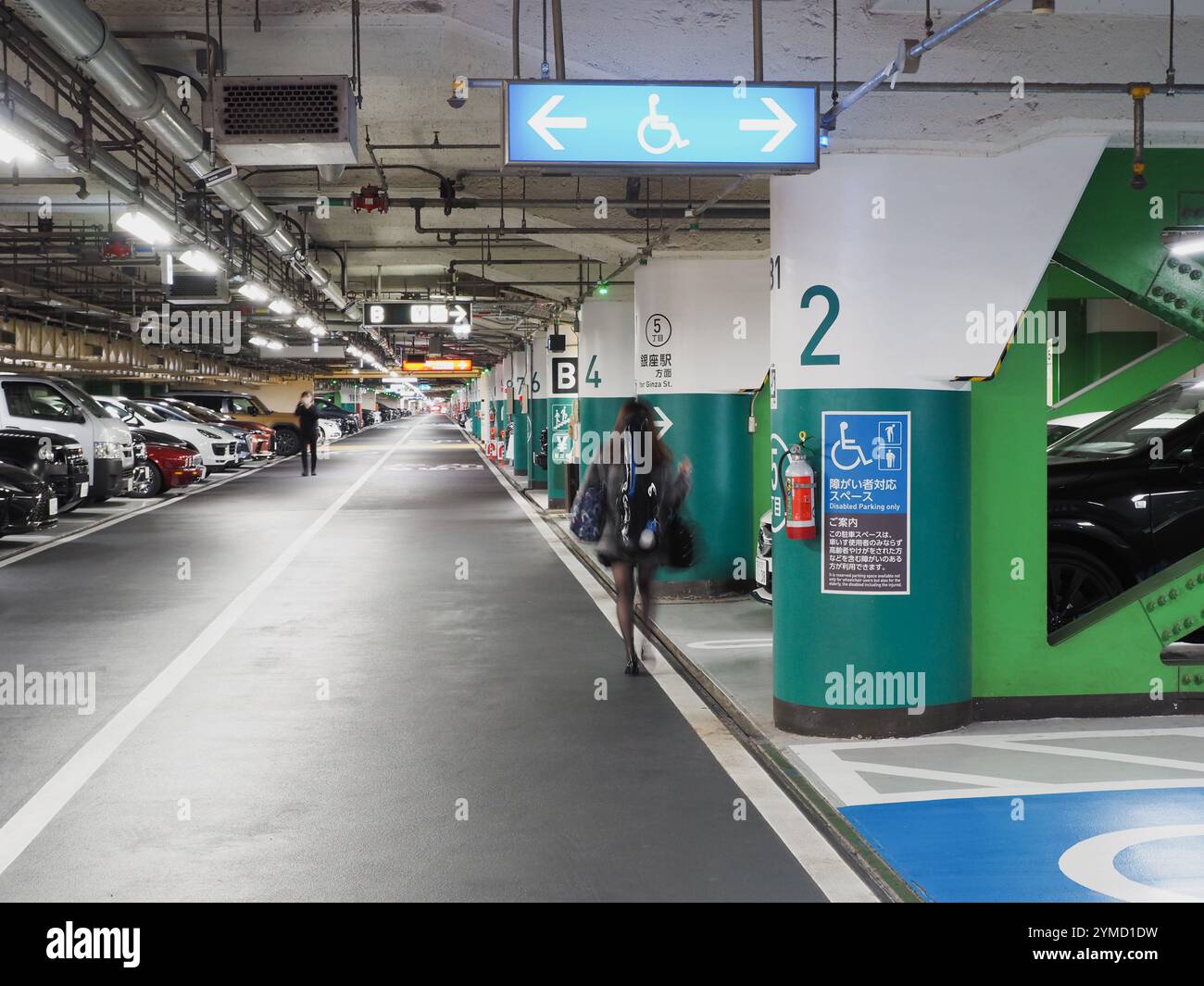 TOKYO, JAPAN - November 13, 2024: An underground car park in Tokyo's ...