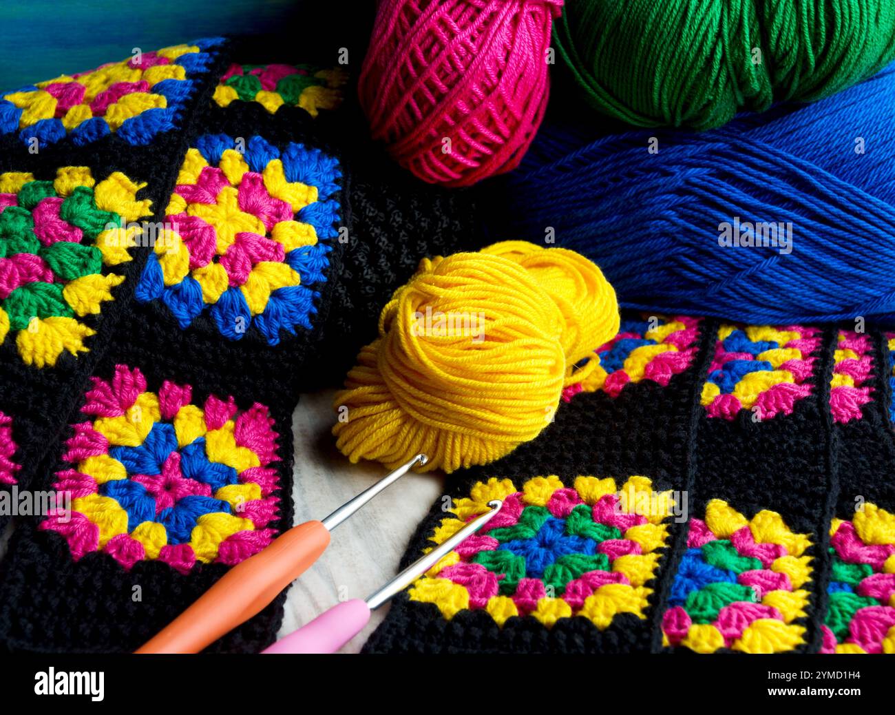 Colorful cotton granny square. Crochet texture close-up, hooks and ...