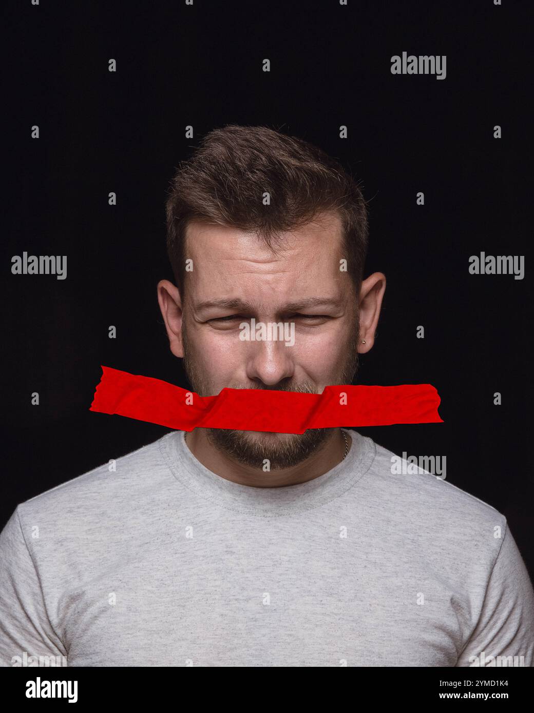 Man with red tape covering his mouth, symbolizing censorship and ...