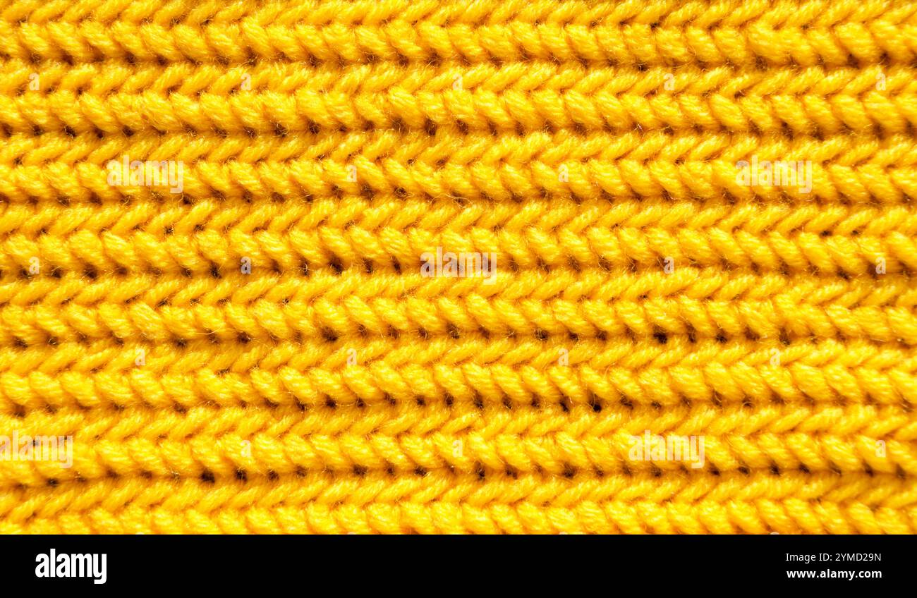 Crochet pattern texture from yellow wool blend yarn. Close-up sample of ...